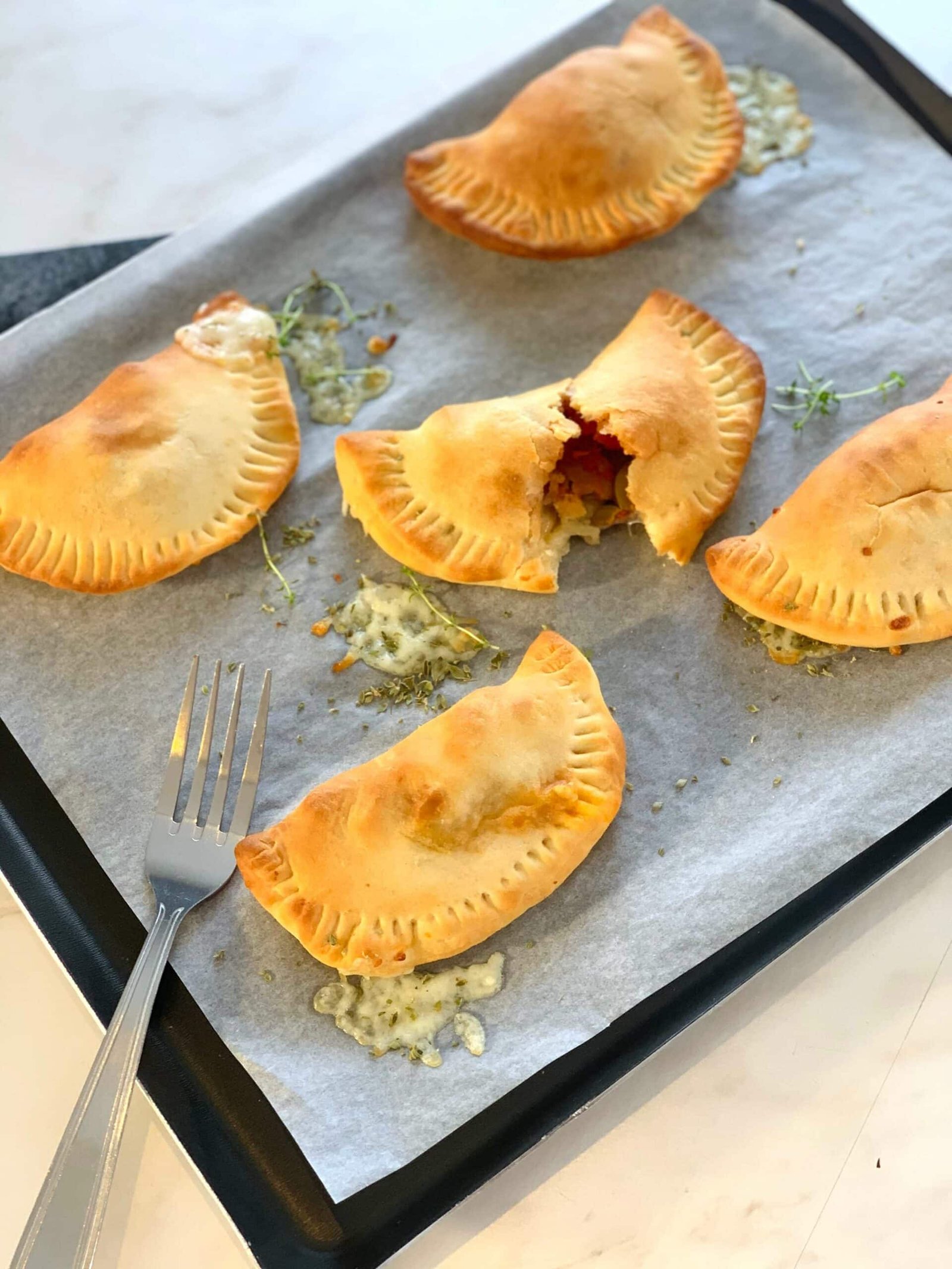 Mini Calzones with Mozzarella, Prosciutto, and Olives - foodydelice.com